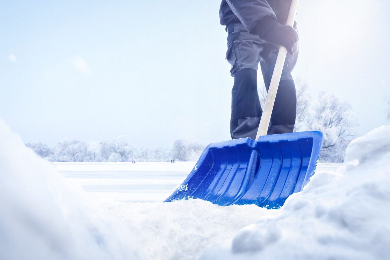 A Guide to Managing Back Pain from Shoveling Snow - AOSMI